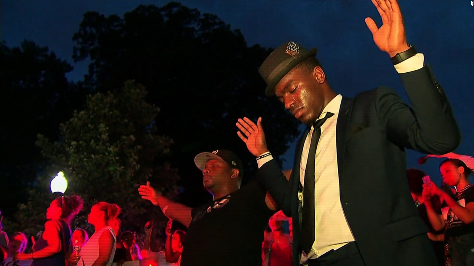 Police shootings protesters sing 'We Shall Overcome' - CNN Video